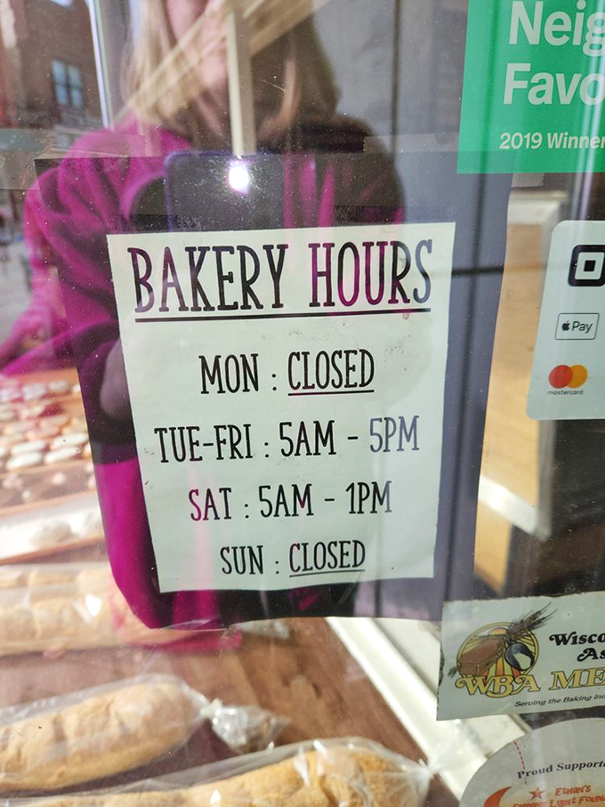 Early birds get the donuts at Quality Bakery, where these hours posted on the door represent the golden window of opportunity.