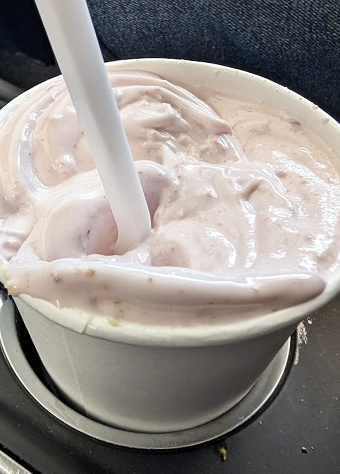 Sip of nostalgia: A thick, creamy strawberry milkshake that requires serious straw strength and rewards the effort with pure bliss.