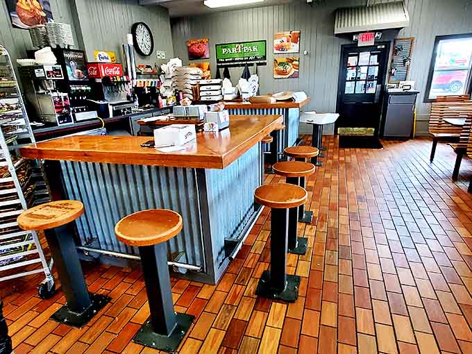 Simple wooden benches and clean lines create the perfect backdrop for the real stars &ndash; those glorious circles of fried dough.