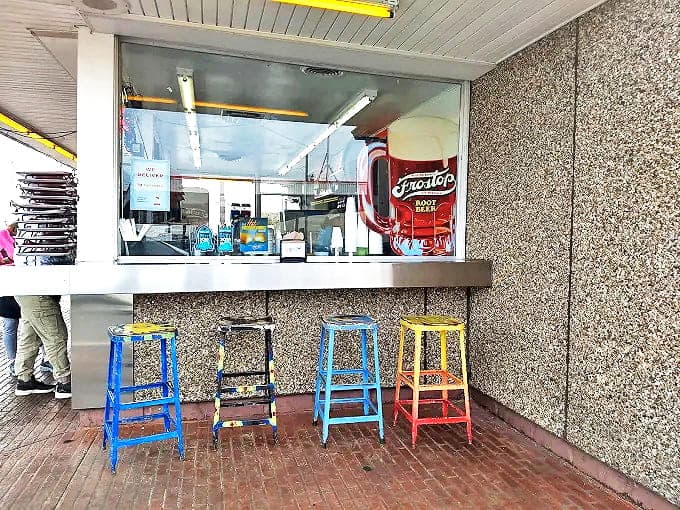 The service counter where magic happens, framed by windows that have witnessed countless first dates, family celebrations, and motorcycle club gatherings.