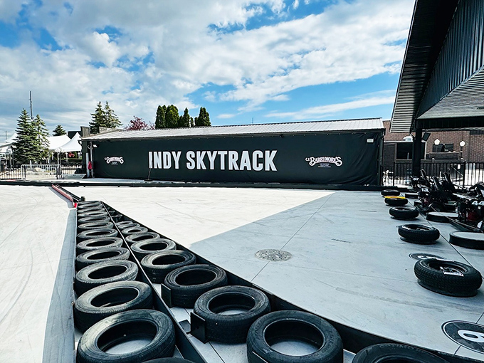 Old tires line the track's edges &ndash; a practical safety feature disguised as a design element that whispers, "We've thought of everything."