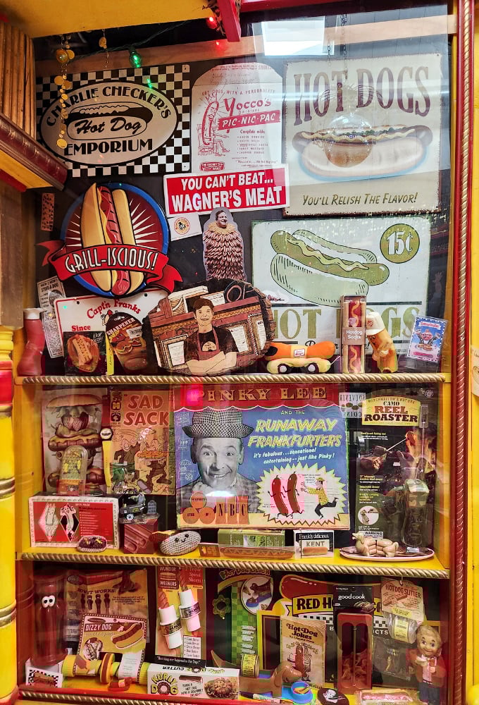 The wall of vintage hot dog advertisements tells America's frankfurter story. From "Grill-iscious!" to "Runaway Frankfurters"&mdash;Madison Avenue's finest wiener work.