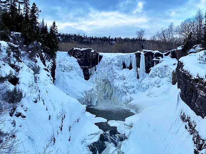 Frozen fantasy world: Winter transforms High Falls into a crystalline sculpture garden where water and ice dance in slow-motion ballet.