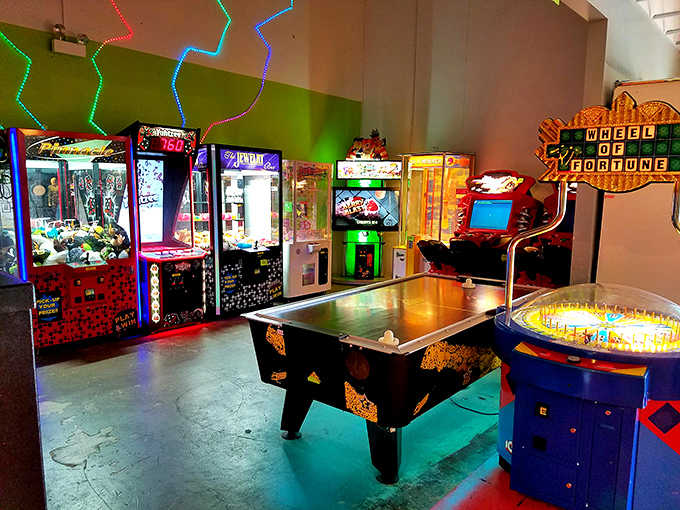 Classic arcade games blink and beckon under cosmic lighting. These retro machines have traveled through time to deliver nostalgic gaming thrills.