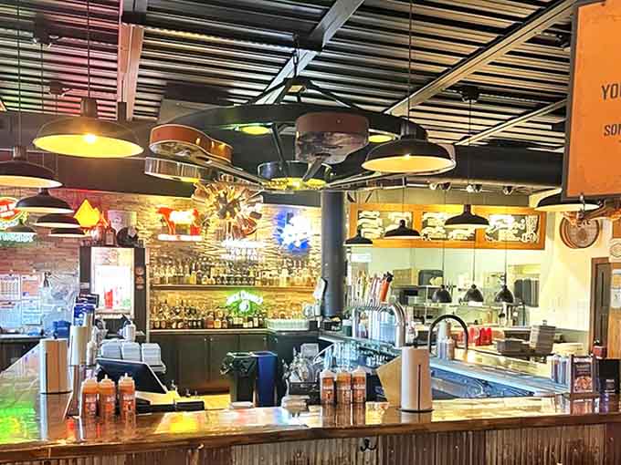 The bar gleams with bottles against exposed brick, while overhead, guitars hang like musical stalactites &ndash; quirky touches that add character.