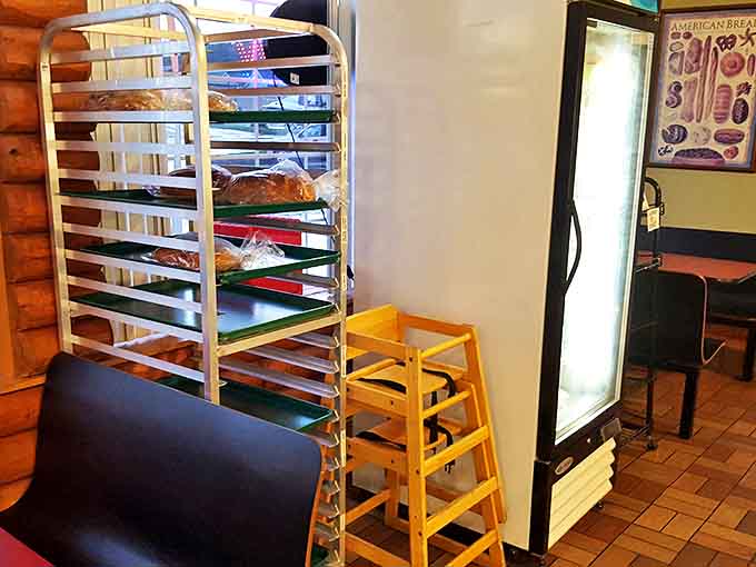 Fresh bread awaits its destiny on cooling racks, the baker's equivalent of a gallery showing before the masterpieces find homes.