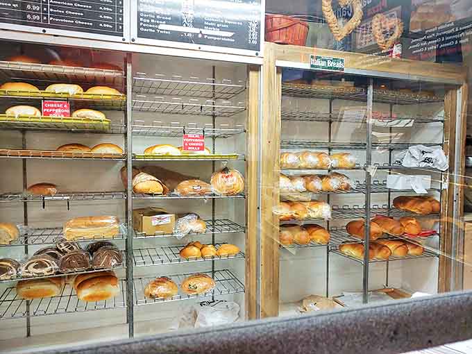 Fresh-baked bread lined up like soldiers ready for duty&mdash;crusty exteriors hiding soft, airy interiors just waiting to become the foundation of your next meal.
