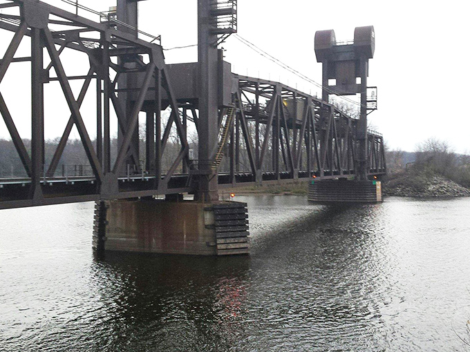 This historic railroad bridge stands as a monument to industrial ingenuity, connecting communities across the mighty Mississippi.