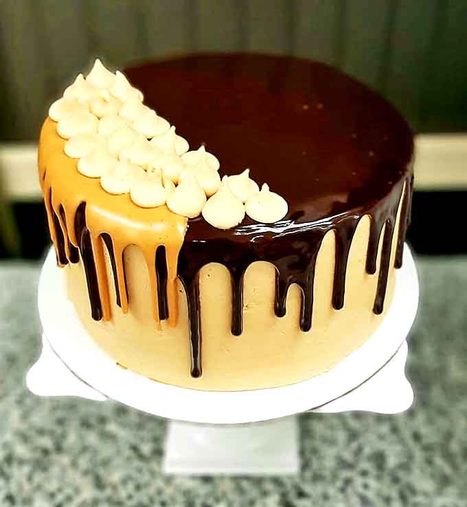 That chocolate drip cascading down the sides of this cake is basically art, the kind you feel slightly guilty about destroying with a fork, but only slightly.