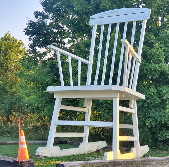 The chair's detailed craftsmanship impresses up close &ndash; someone built this enormous rocker with the same care your grandmother's actual chair received.