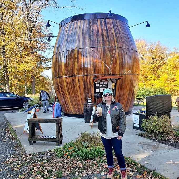 A satisfied customer enjoys the fruits of community preservation efforts &ndash; that smile says everything about the barrel's enduring appeal.