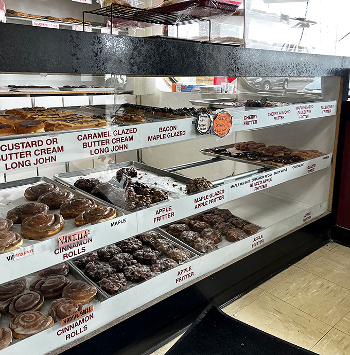 The display case &ndash; a museum of fried dough where classics like maple bars and cinnamon rolls wait patiently for their forever homes.