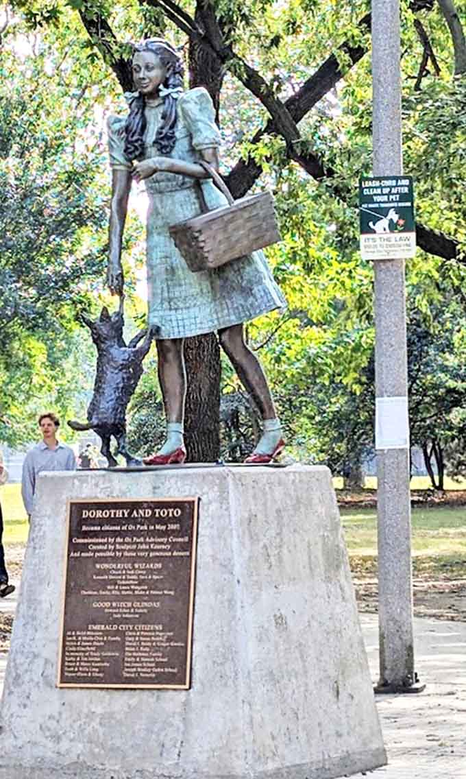 Dorothy and Toto stand frozen in bronze mid-adventure, the final characters to join this magical reunion in 2007, completing the beloved collection.