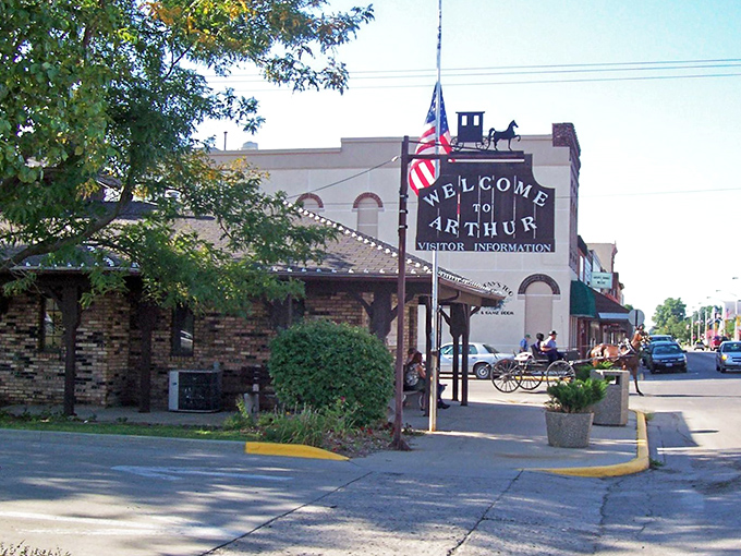 The Arthur welcome center greets visitors with Midwestern hospitality and a horse-drawn buggy silhouette that sets the perfect tone.