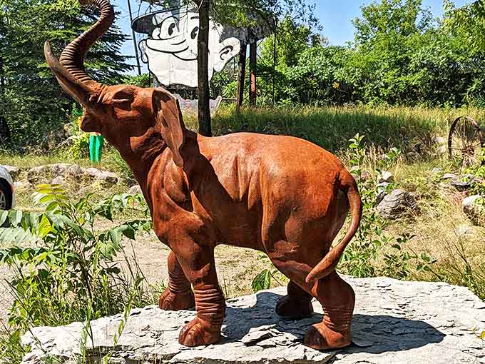 This rusty pachyderm trumpets a welcome to passersby, its weathered form capturing the artistic spirit of this unique roadside attraction.