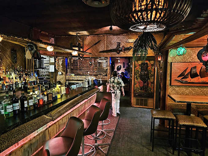 The interior feels like stepping into a 1960s postcard from Hawaii &ndash; bamboo, rattan, and dim lighting creating the perfect escape from Midwestern reality.