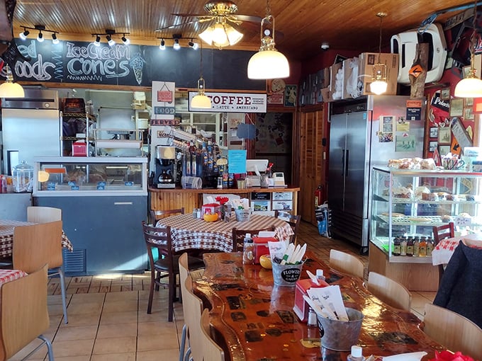 Pendant lights cast a warm glow over rustic tables, creating the kind of lighting that makes everyone look like they're in a Norman Rockwell painting.