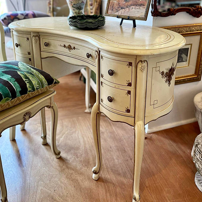 This kidney-shaped writing desk with delicate painted details would have Marie Antoinette feeling right at home &ndash; French elegance meets Minnesota charm.