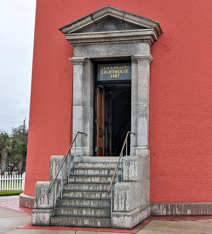 Grand entrance, indeed! The lighthouse doorway stands like a portal to the past, its granite steps worn by generations of keepers and visitors seeking the light.