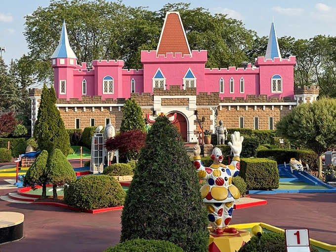 Fairytale architecture meets mini-golf magnificence &ndash; complete with a clown ambassador who's clearly dressed for the occasion.