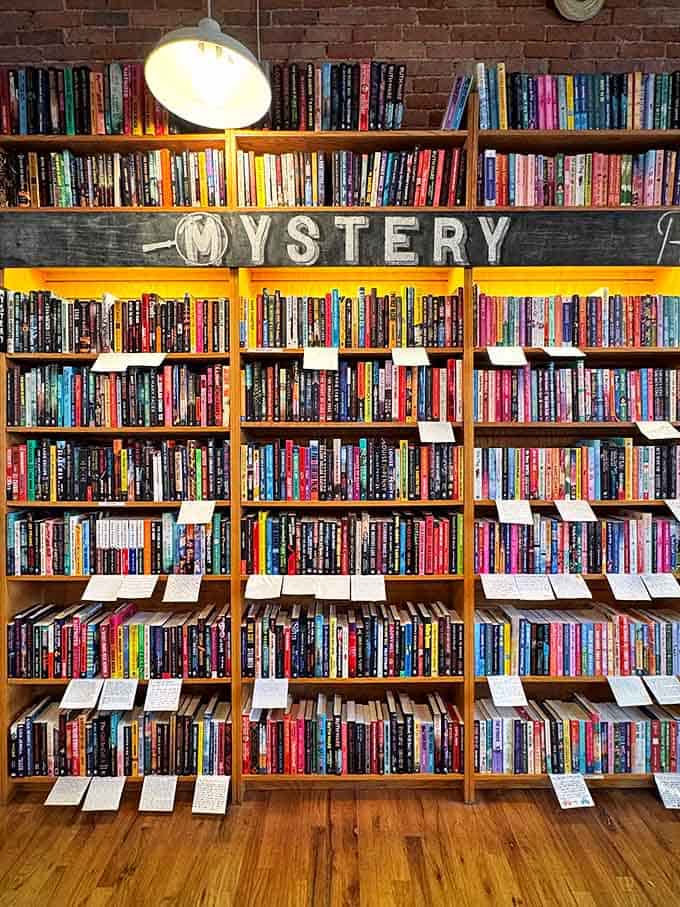 The mystery section stands ready to transport readers into worlds of intrigue, with spines aligned like suspects in a particularly literary police lineup.