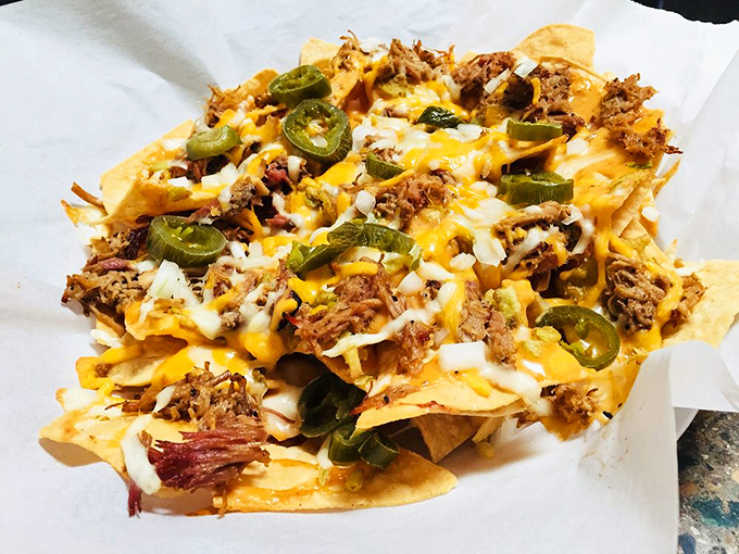 BBQ meets Tex-Mex in this mountain of crispy chips, smoked meat, melty cheese, and jalape&ntilde;o kick.