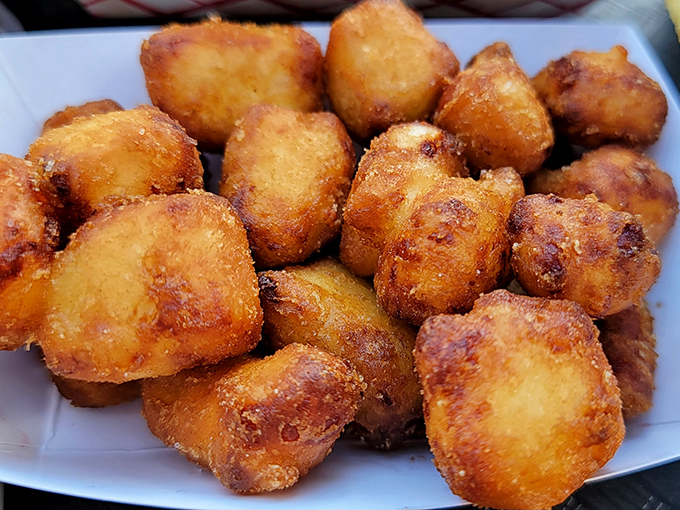 Cheese curds that would make any Wisconsinite proud – golden nuggets of fried perfection with that signature "squeak."