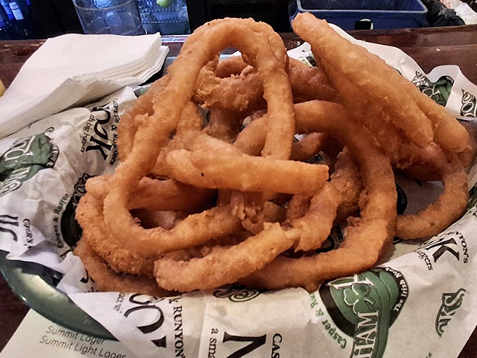 Onion rings that deserve their own fan club - golden, crispy, and substantial enough to satisfy even the most dedicated fried food enthusiast.