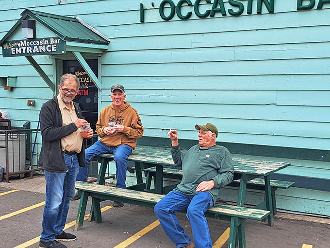 Locals enjoy the outdoor seating area, where conversations about the bar's unusual interior inevitably become the topic of discussion.