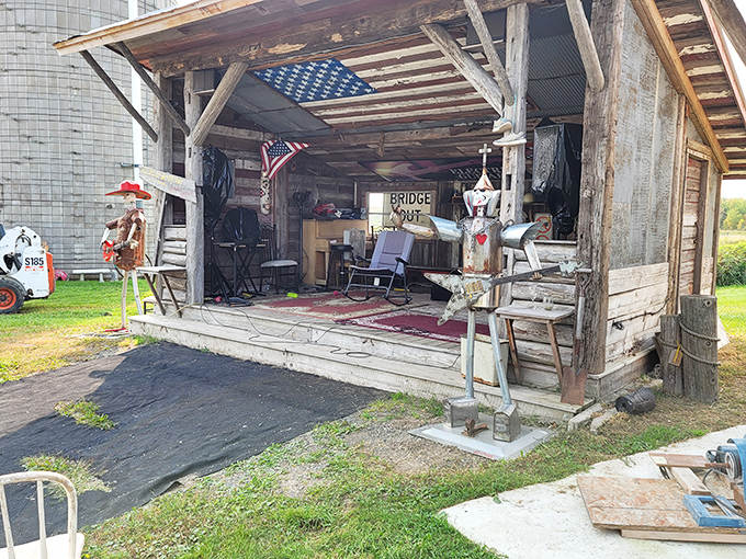 The rustic outdoor stage waits patiently for performers, its weathered boards having hosted everything from bluegrass bands to impromptu antique show-and-tells.