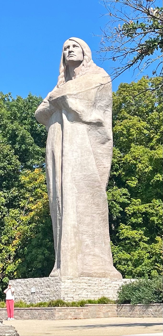 A human figure provides scale, making it clear just how enormous this concrete sentinel truly is &ndash; think "honey, I shrunk the tourists."