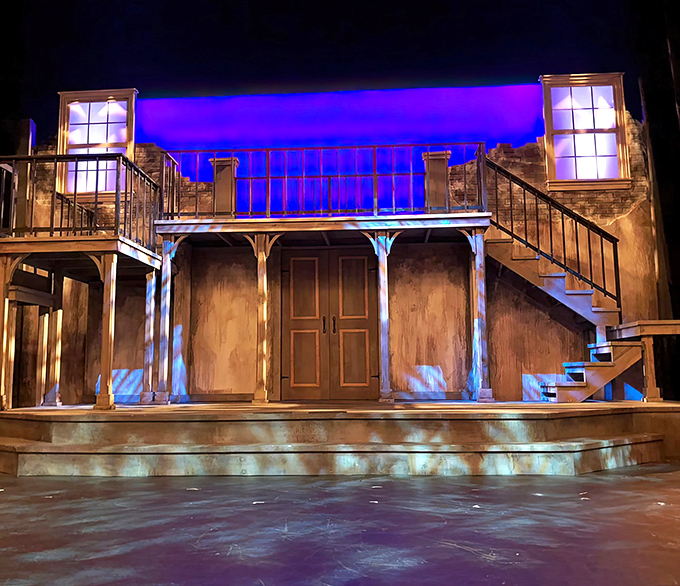 A stage set-up awaits its performers, the technical elements of modern entertainment seamlessly integrated into this historic theatrical treasure.