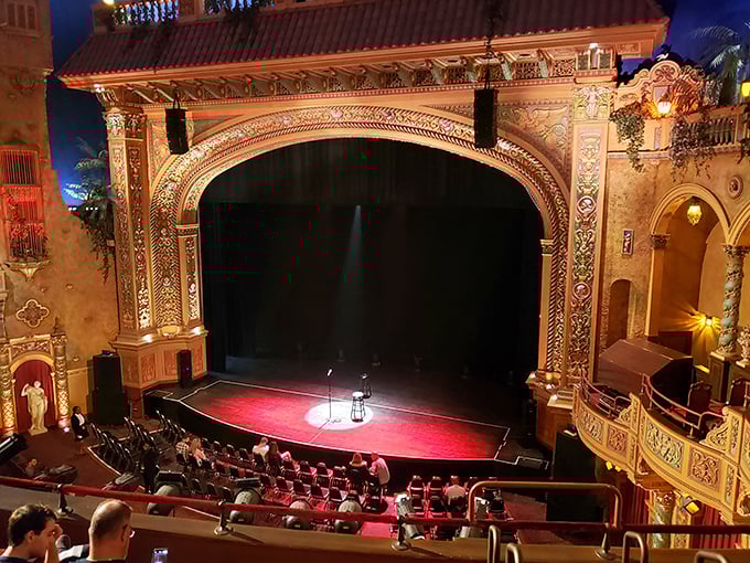 The view from the balcony reveals the full splendor of the stage framed by the theater's elaborate atmospheric design.
