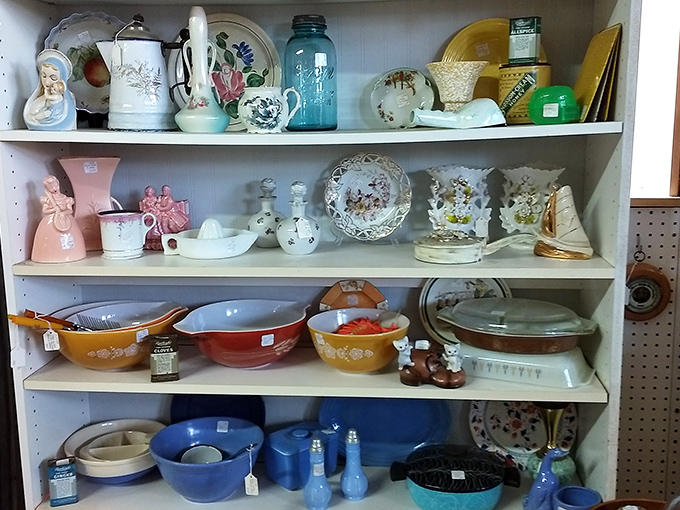 Your grandmother's kitchen comes alive in this nostalgic display. Vintage Pyrex and delicate china recall Sunday dinners and holiday gatherings of yesteryear.