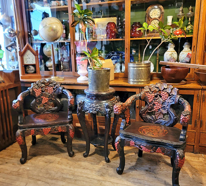These aren't just chairs – they're hand-carved conversations with craftsmen who worked a century ago, their grape motifs still perfectly preserved.