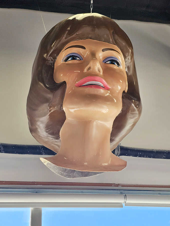 This vintage female head display showcases the detailed features and somewhat eerie charm that characterized these massive marketing marvels.