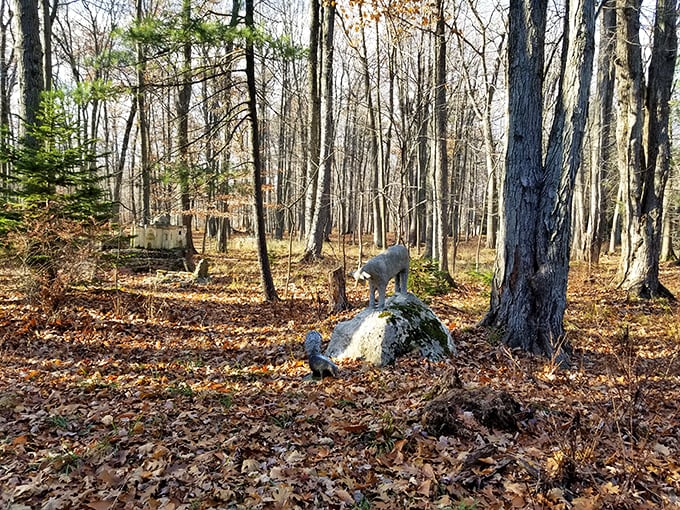 Concrete creatures peek from autumn leaves, playing an endless game of hide-and-seek with delighted visitors to this magical woodland.