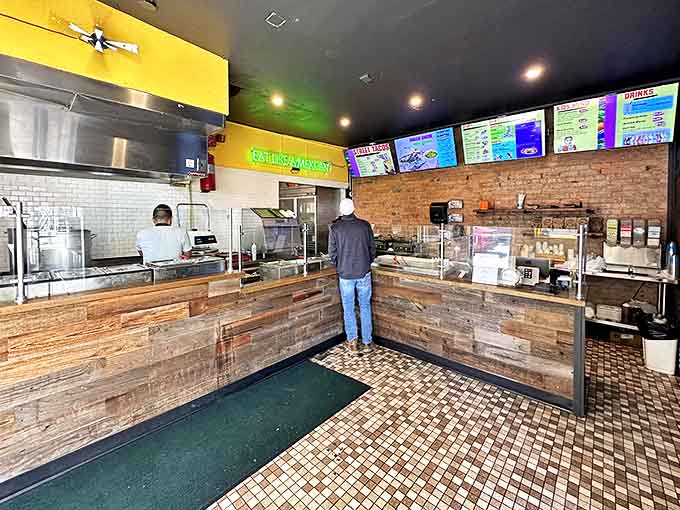 Where the magic happens: rustic wood paneling meets efficient service at a counter that's seen thousands of first-bite smiles.