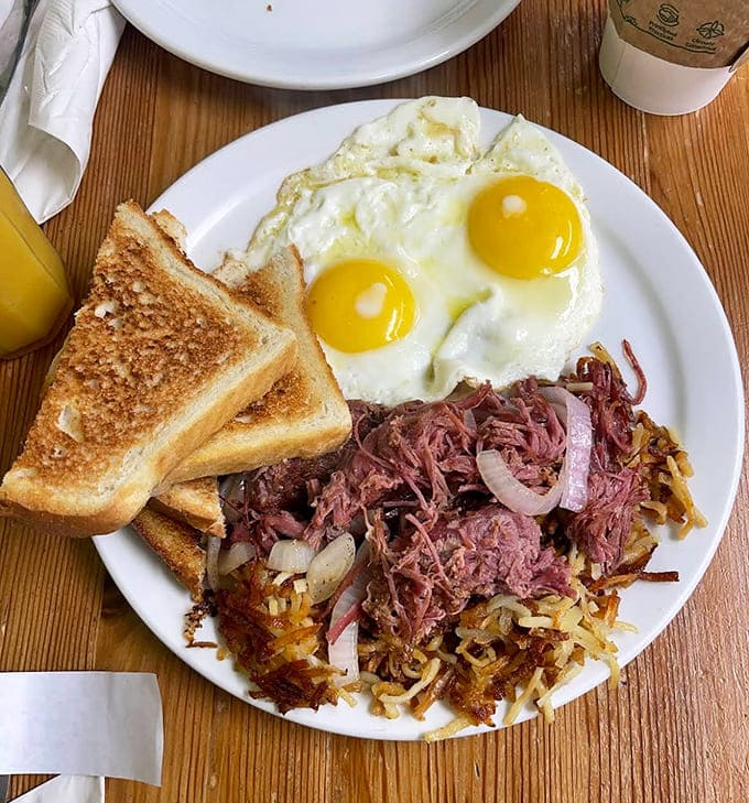 Crispy potatoes, tender corned beef, and those sunny-side-up eggs &ndash; this plate doesn't just say good morning, it sings it.