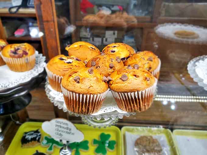 These chocolate chip muffins sit proudly on their doily throne, looking innocent while plotting to destroy any remaining willpower you possess.