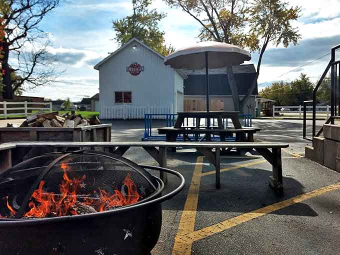 The outdoor dining area invites guests to enjoy their barbecue feast al fresco, with fire pits adding ambiance and warmth.