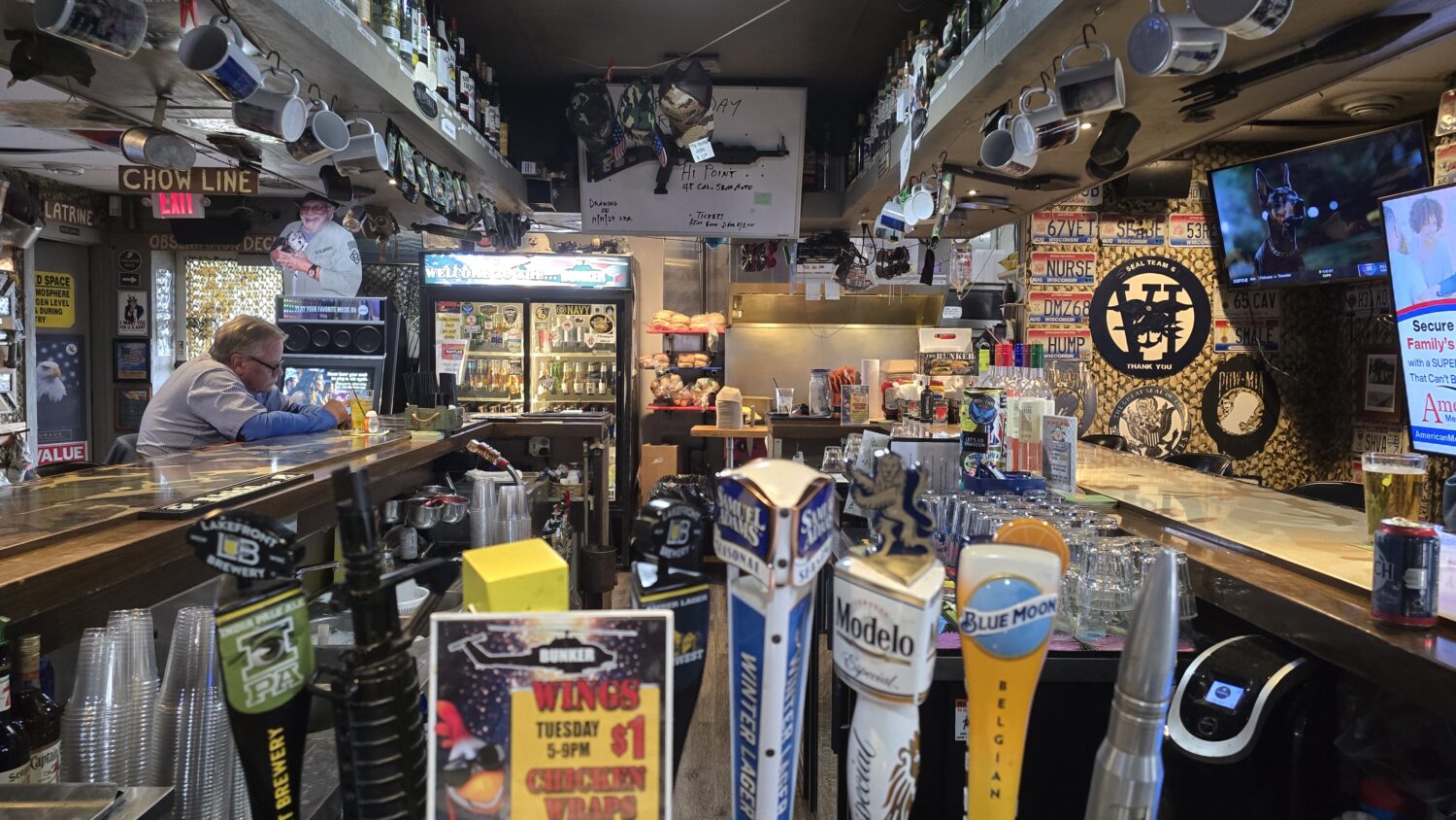 Behind the bar, an impressive array of taps and bottles stands ready to quench any thirst &ndash; liquid reinforcements for hungry patrons.