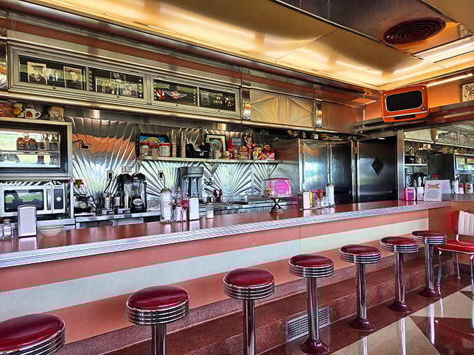 Counter seating with classic red vinyl stools offers front-row tickets to the short-order cooking show &ndash; kitchen theater at its most delicious.