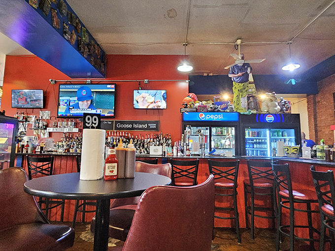 The bar area glows with promise, bottles standing at attention like soldiers ready to complement your barbecue adventure with liquid reinforcements.