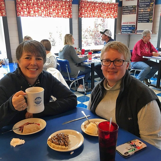 Happy diners sharing stories and pie &ndash; the universal language of "this is so good you have to try it" transcends all barriers at Betty's tables.