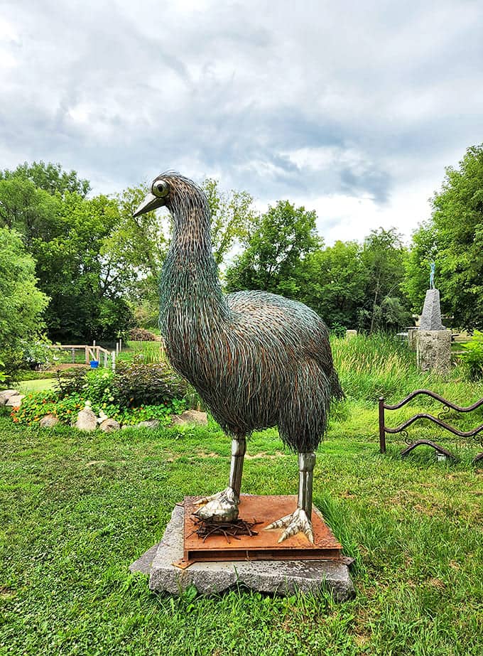 Towering above golfers, this massive bird sculpture watches with keen interest, its intricate metal feathers catching the Minnesota sunlight.