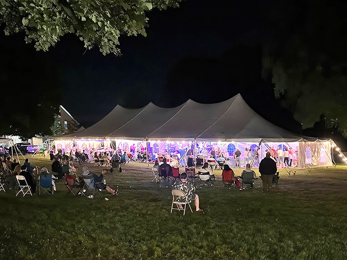 When night falls, the music rises, drawing crowds who dance under canvas tents as if tomorrow might never come.