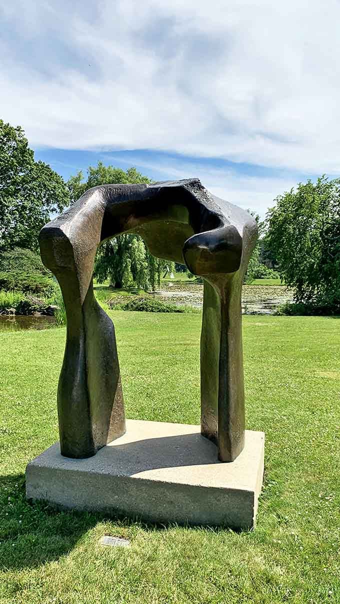 Two abstract forms create a portal that seems to invite visitors into another dimension, its smooth bronze surface begging to be touched.