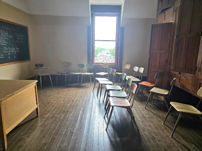 Empty chairs await phantom students in the prison classroom, where education offered rare hope in an otherwise bleak existence.