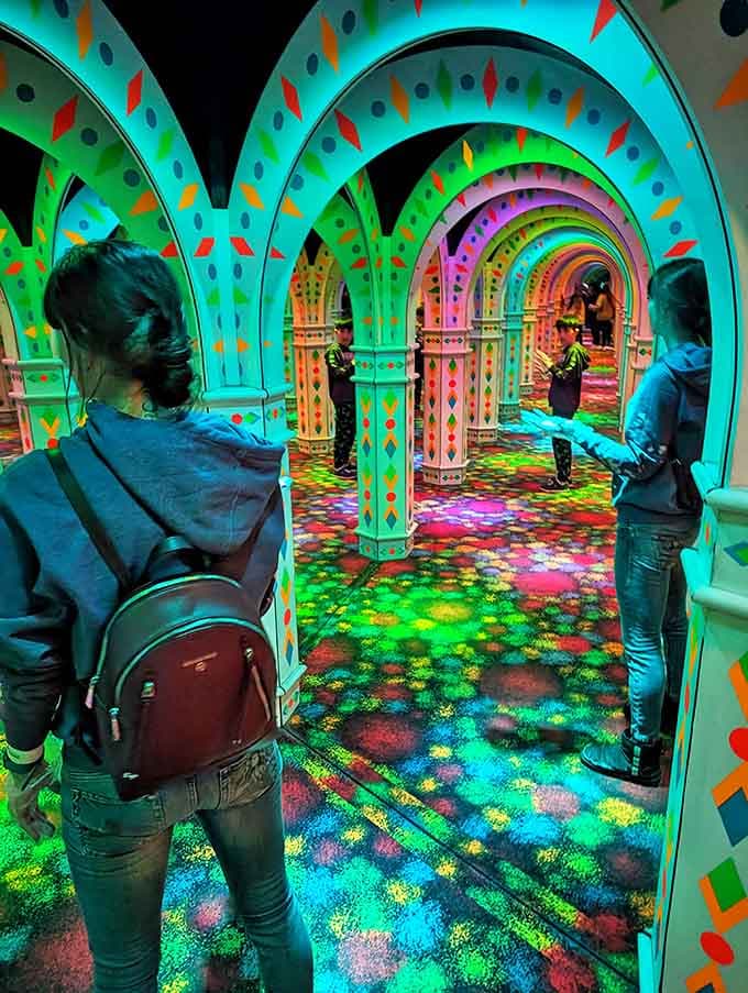 Diamond patterns and vibrant hues transform ordinary columns into extraordinary visual elements that guide and confuse simultaneously.